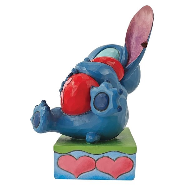 Disney Traditions Stitch Hugging a Heart Figurine - threelittlebears.co.uk
