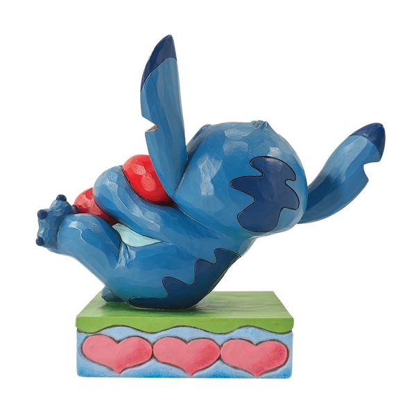 Disney Traditions Stitch Hugging a Heart Figurine - threelittlebears.co.uk
